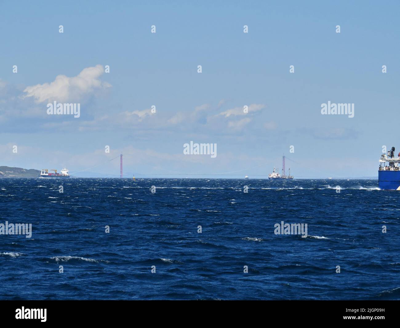 Cargo ship crossing the strait , 1915 Canakkale Bridge in background ...