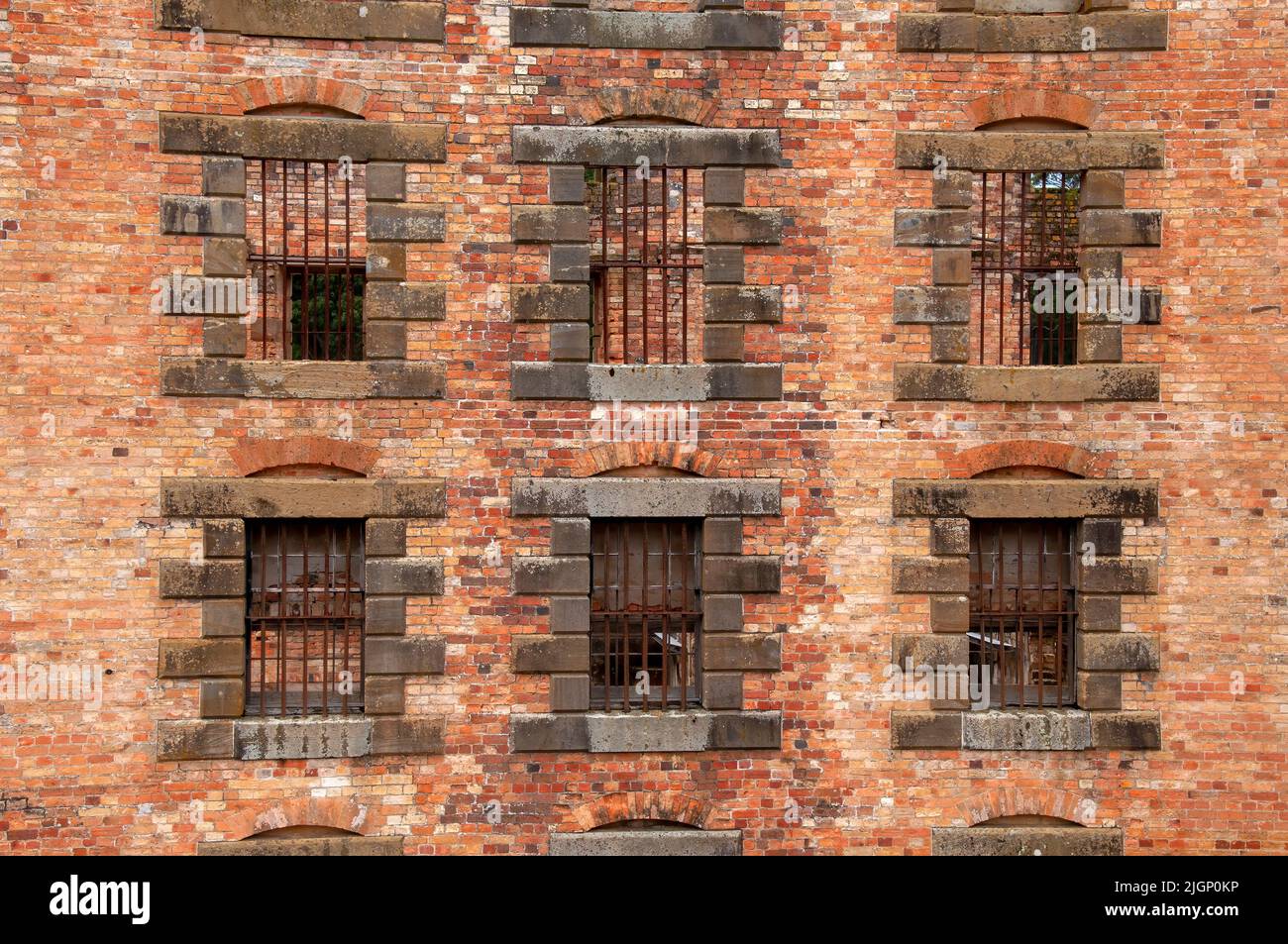 Port Arthur Australia, heritage building of red brick with metal bar ...