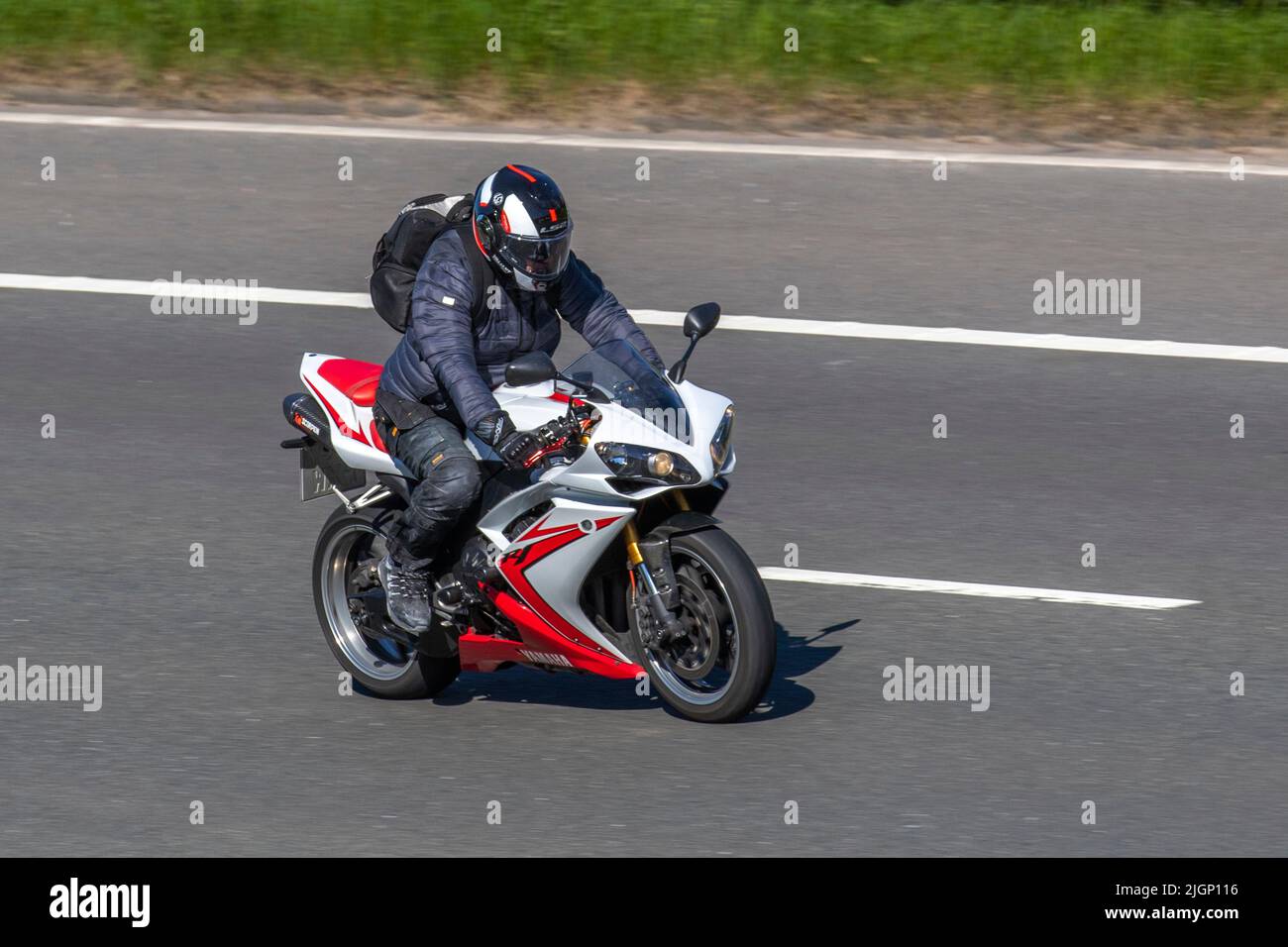 Red white Yamaha Scorpio Z 225 cc; travelling on the M61 Motorway ...