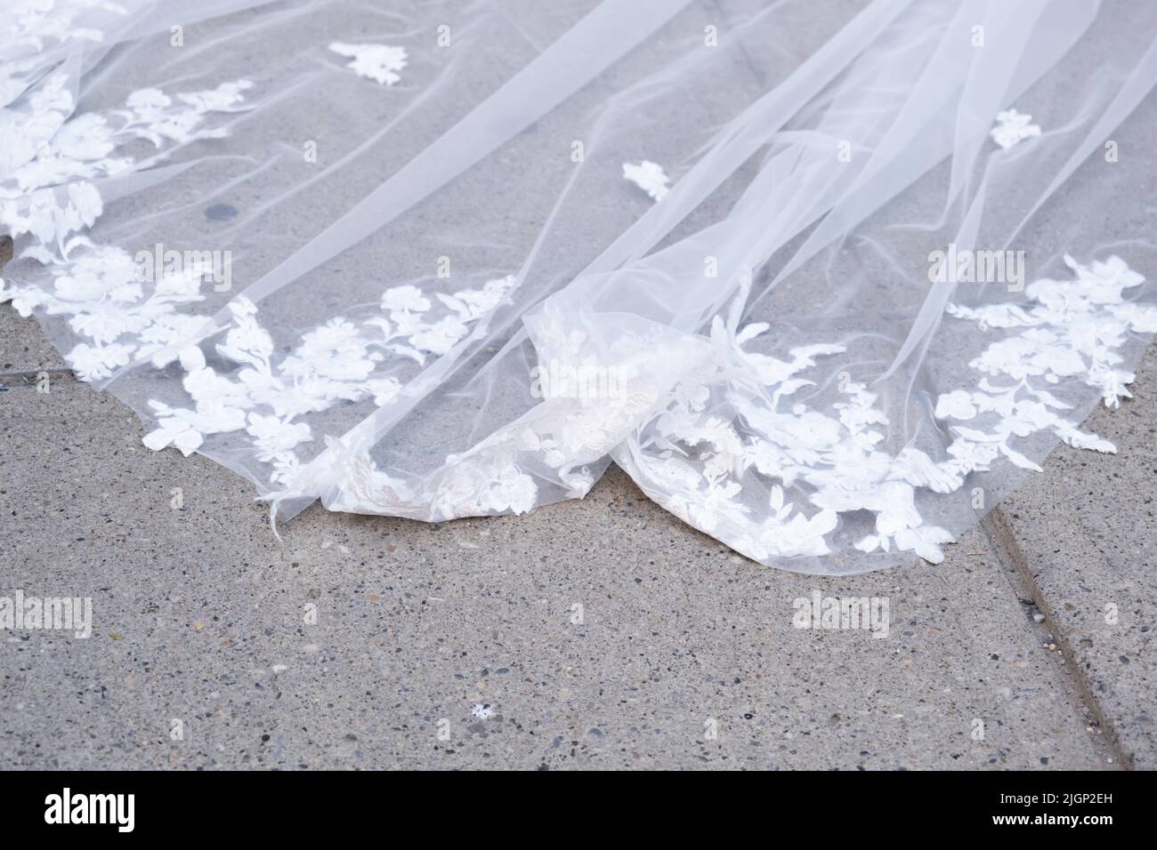 A brides Bridal train at a wedding Stock Photo - Alamy