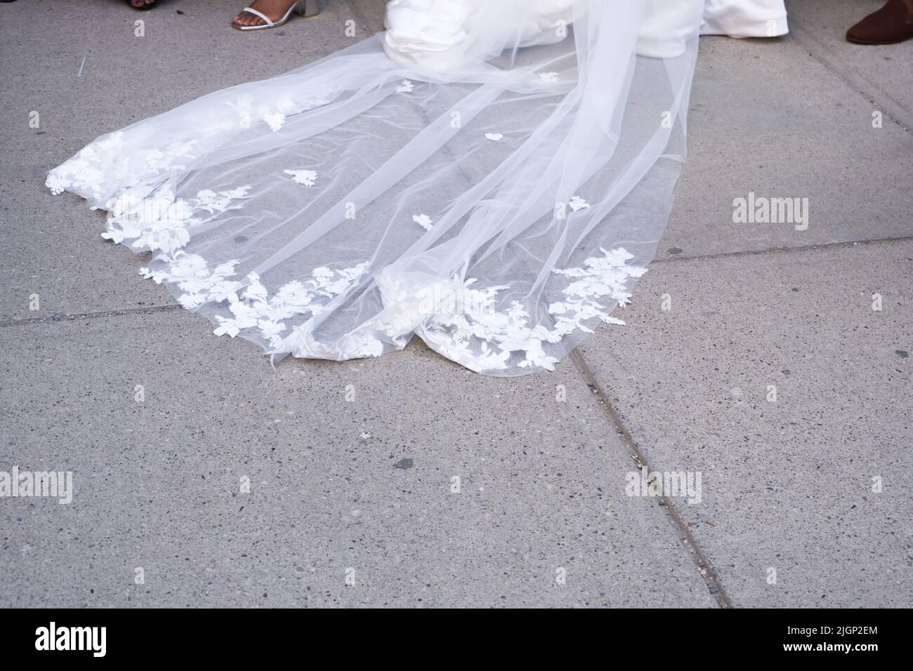 A brides Bridal train at a wedding Stock Photo - Alamy
