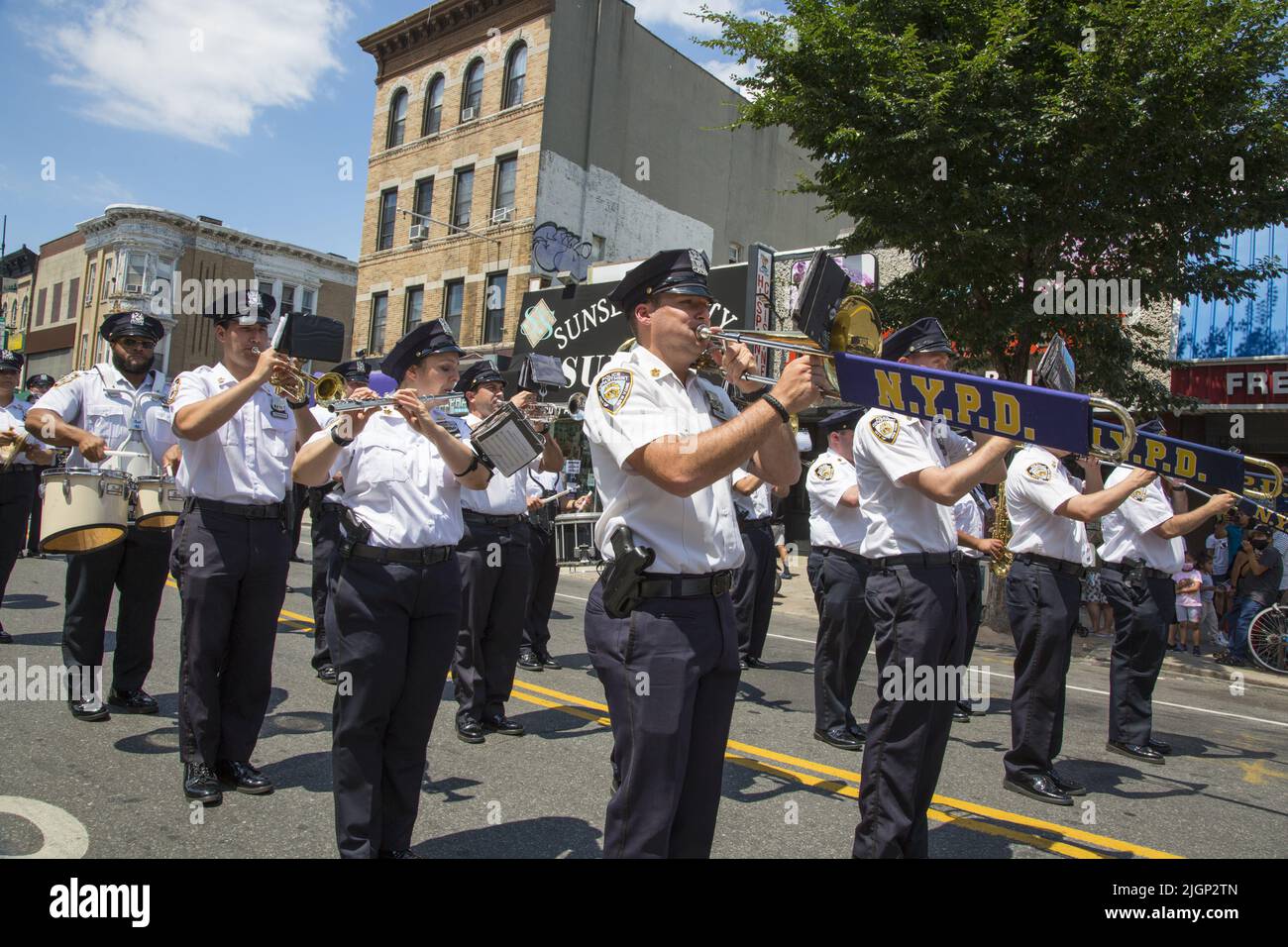 NYPD officers and marching band march in an American Independence Day ...