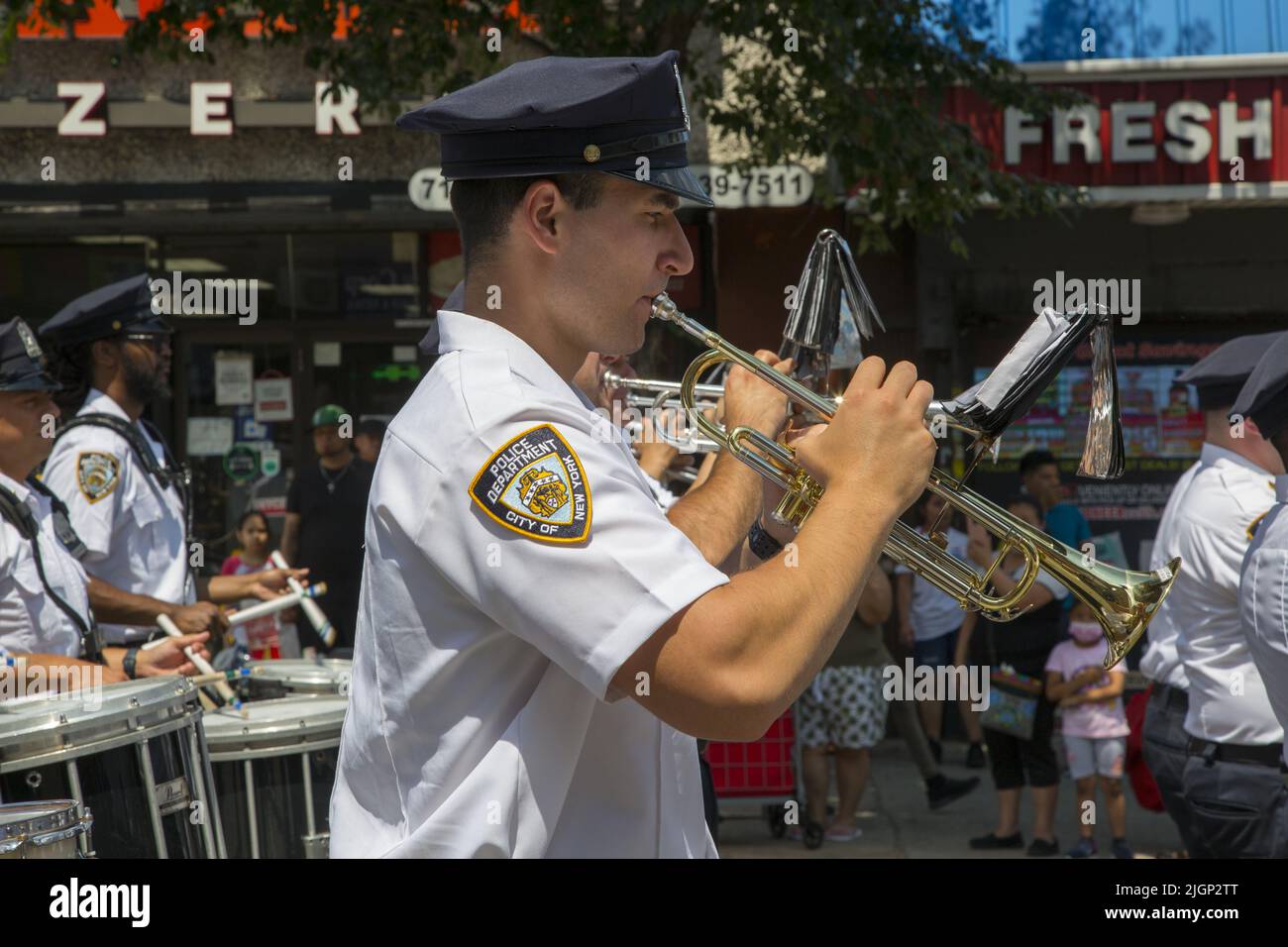 NYPD officers and marching band march in an American Independence Day ...