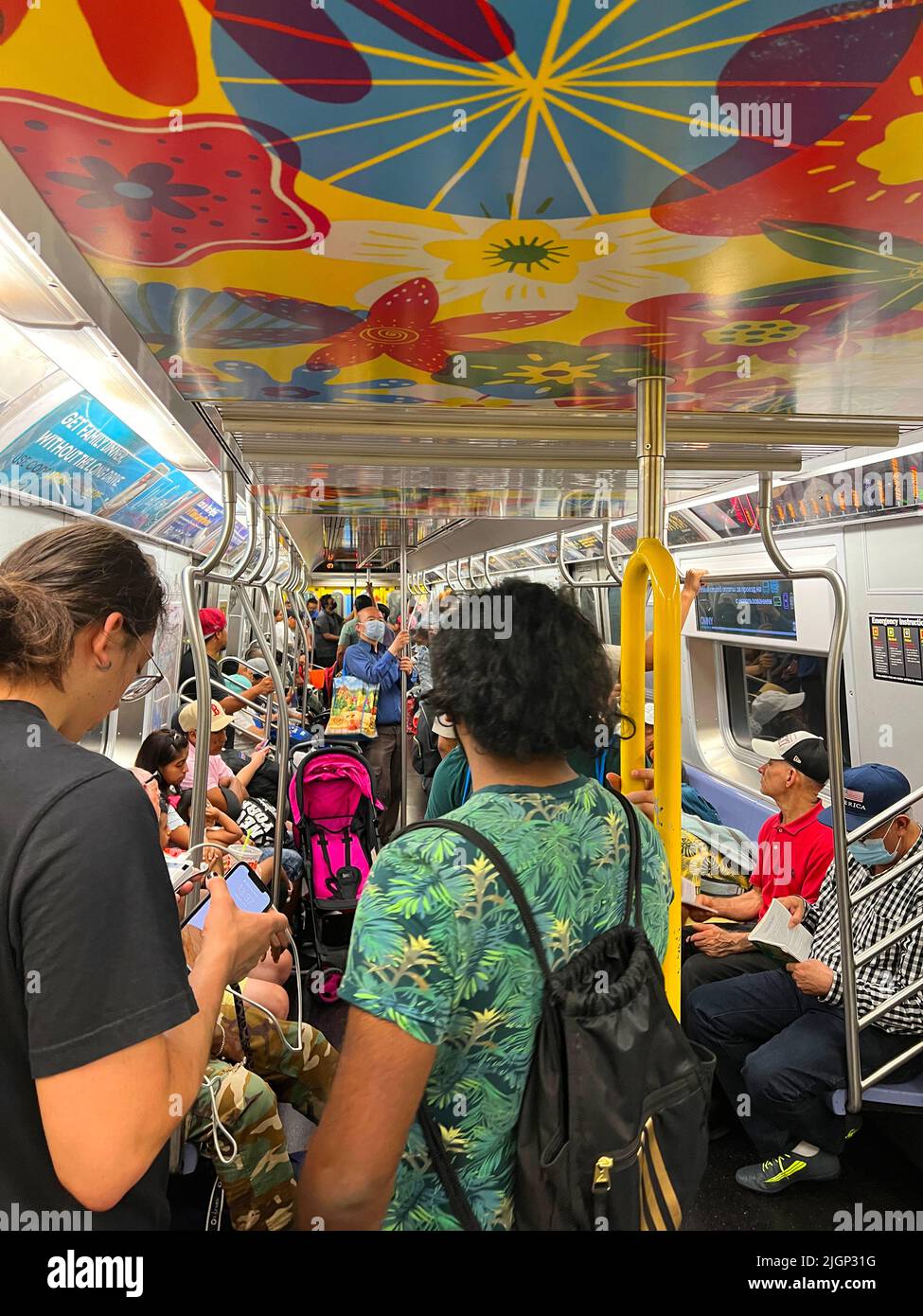 Riders on a colorfully decorated F Train headed toward Coney Island in ...