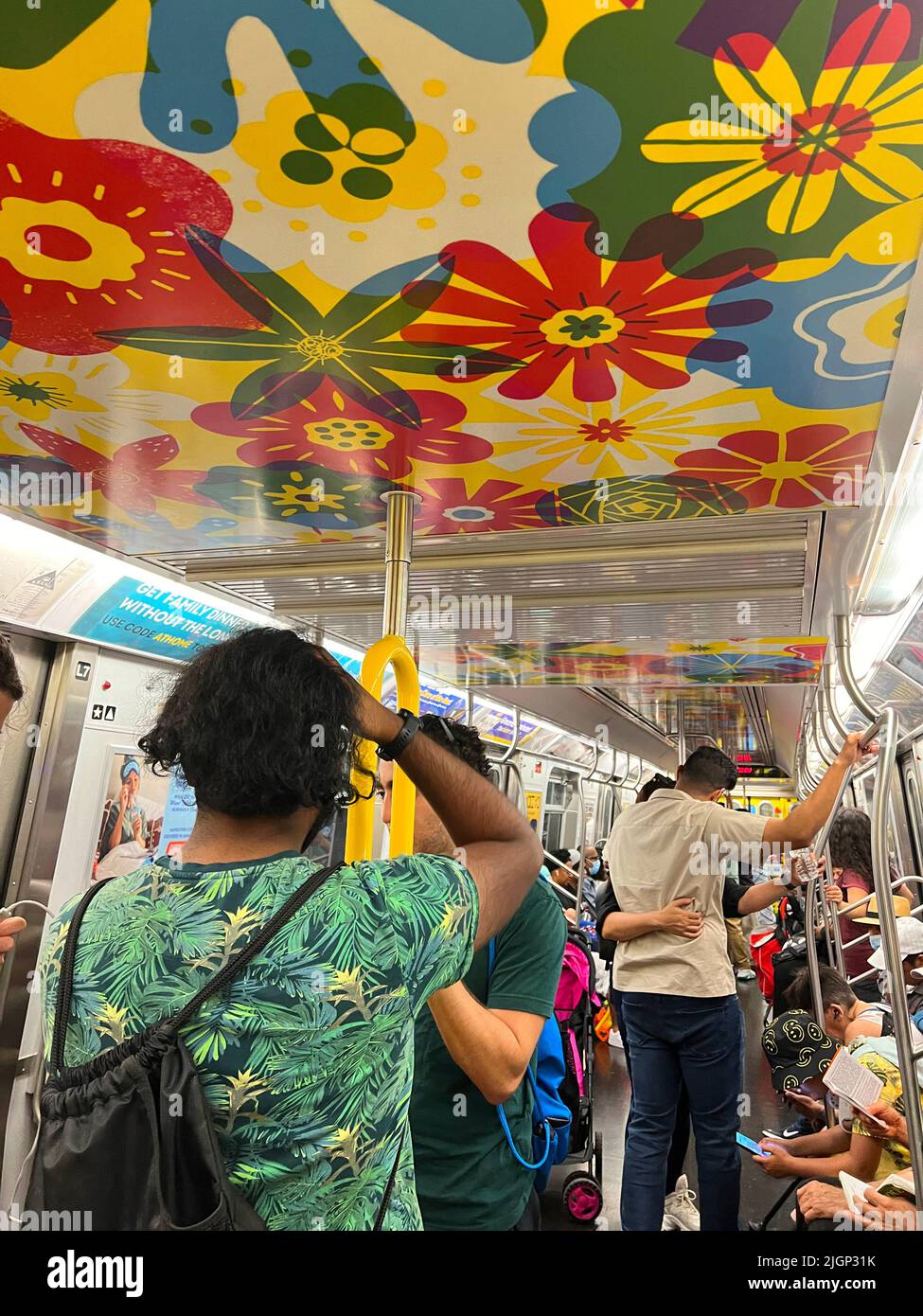 Riders on a colorfully decorated F Train headed toward Coney Island in ...