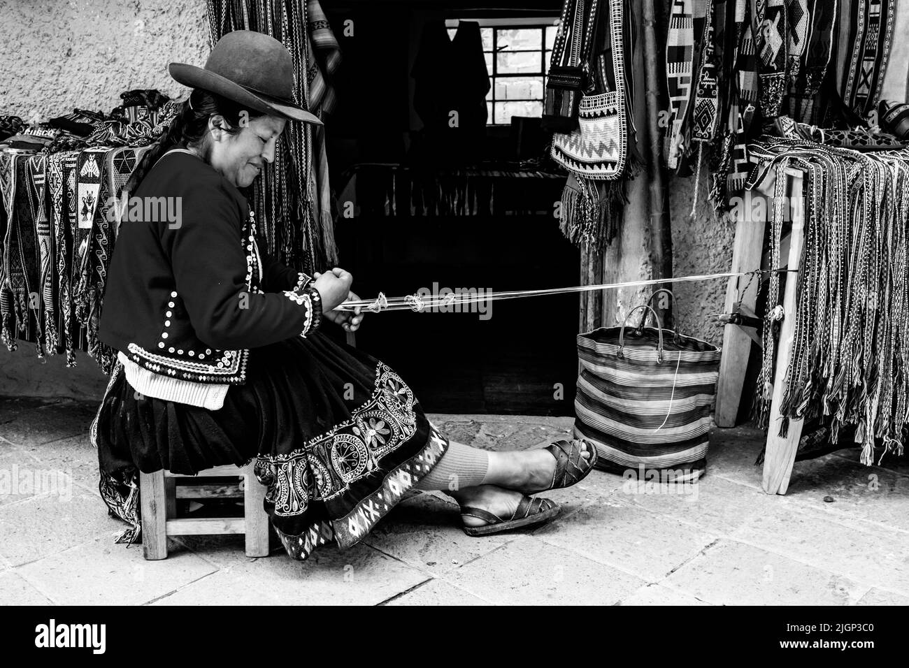 An Indigenous Woman Showing The Traditional Method Of Weaving Wool In ...