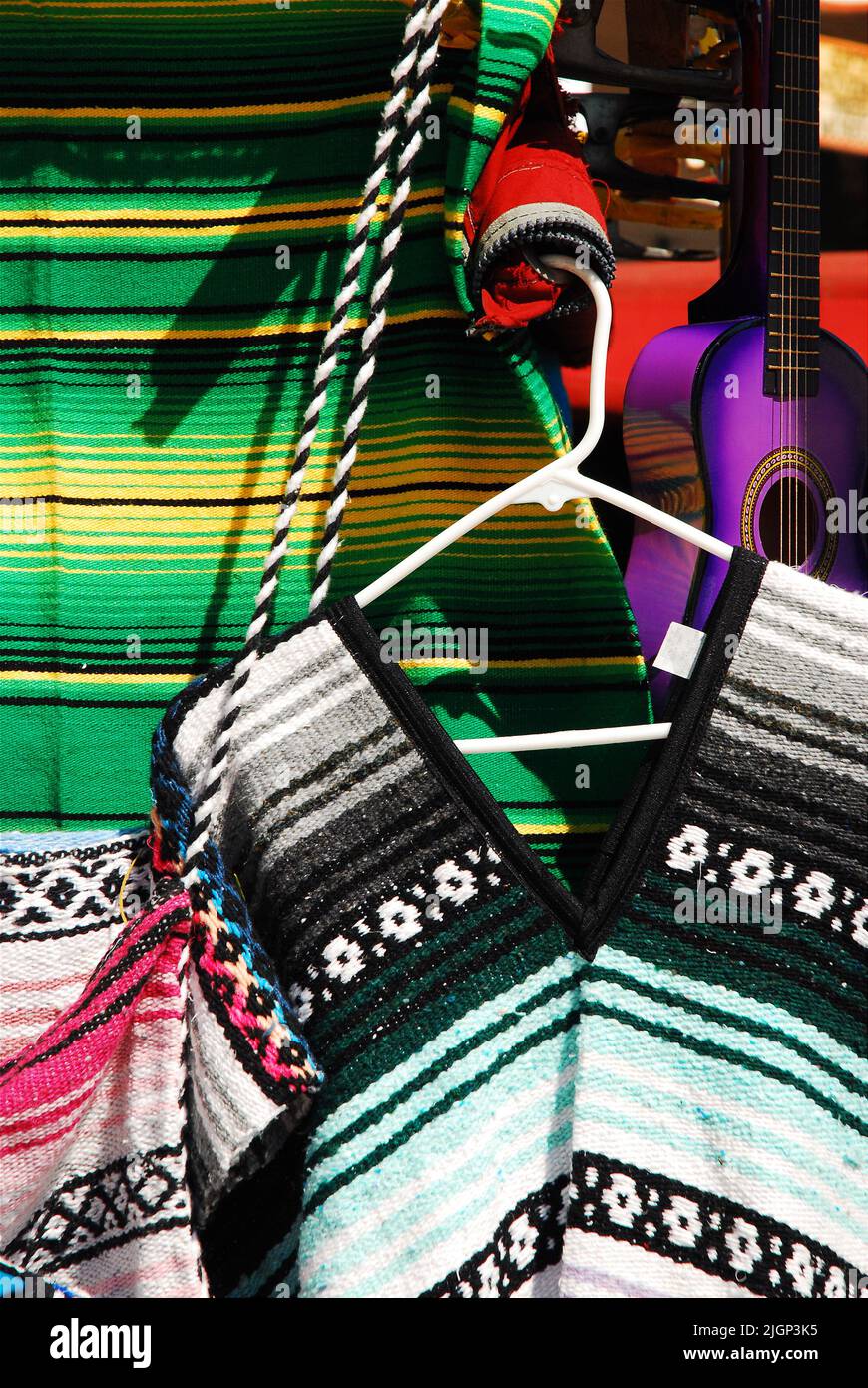 Traditional Mexican sweaters and hoodies are on retail display at a ...