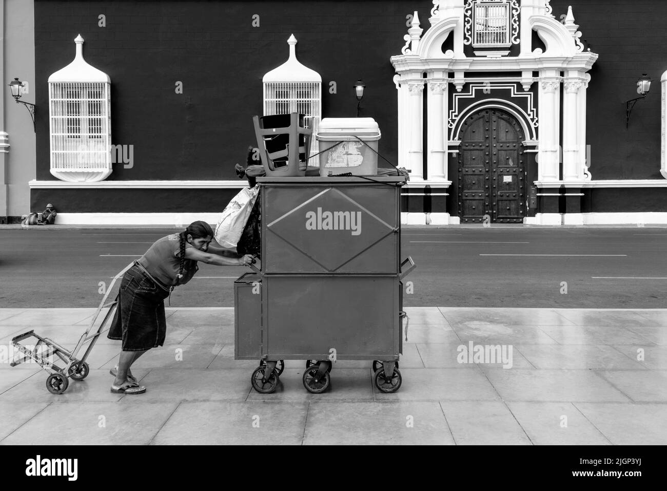 An Elderly Woman Pushes Her Mobile Food Kiosk Through The Plaza De ...