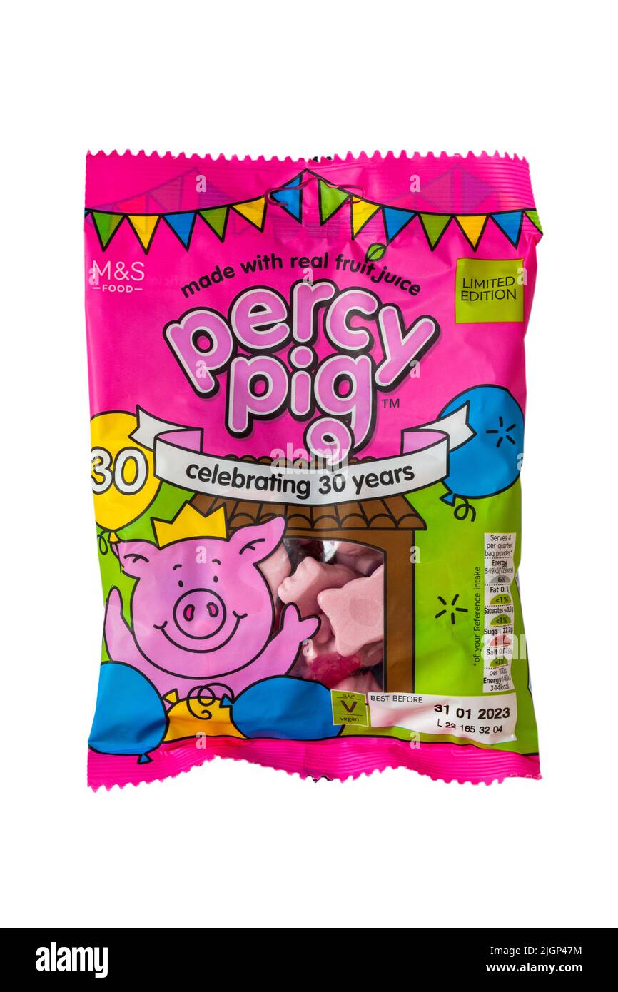 Bag of M&S Percy Pig sweets celebrating 30 years made with real fruit juice isolated on white ...