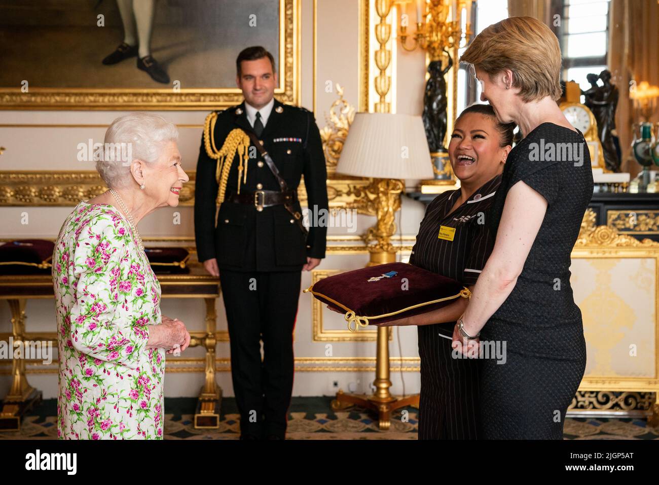 Queen Elizabeth II, presenting the George Cross to Ms Amanda Pritchard ...