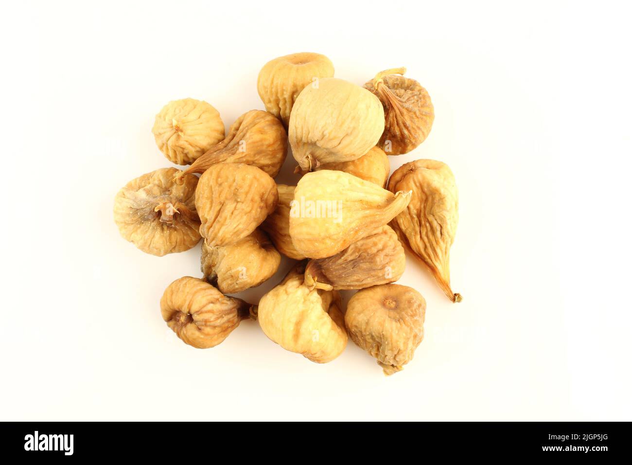 Pile of dry old figs isolated on white background Stock Photo - Alamy
