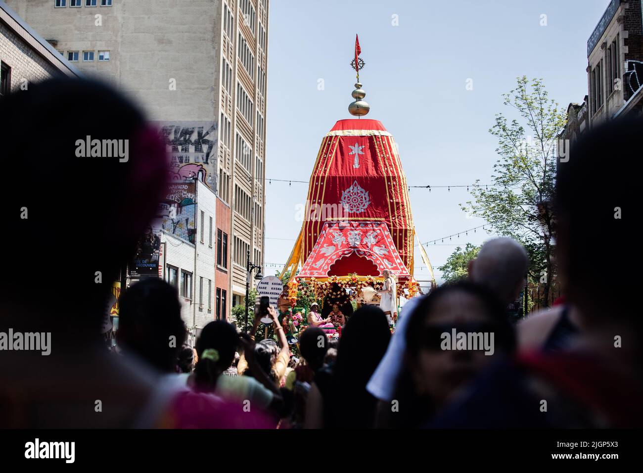 The crowd of devotees march with the main float cart during the ...