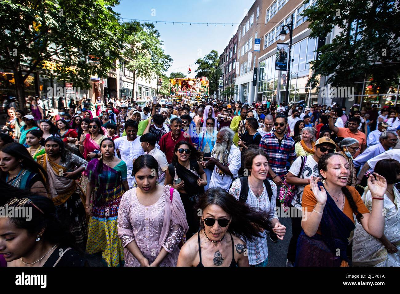 The crowd of devotees march with the main float cart during the ...