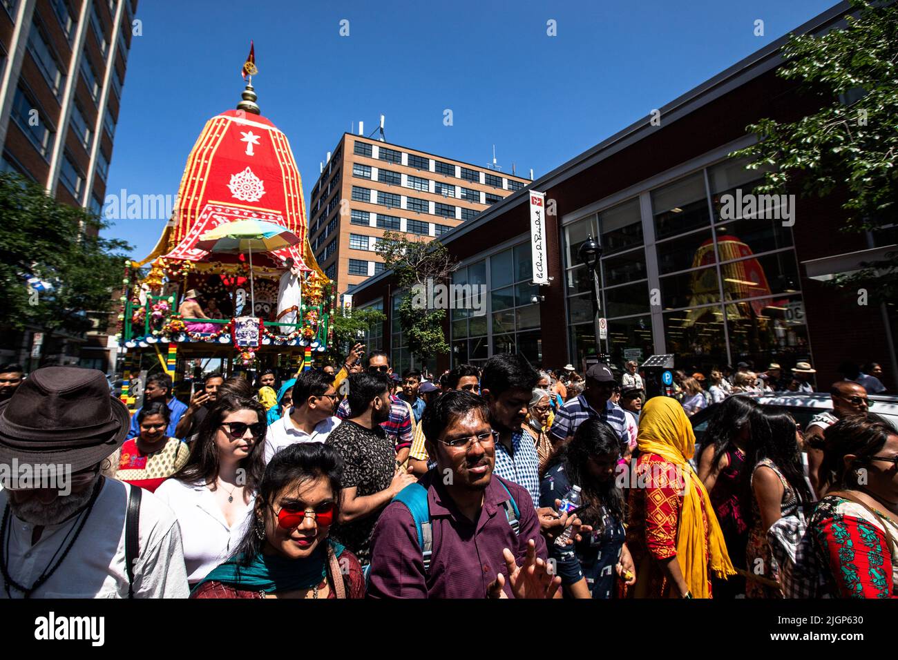 The crowd of devotees march with the main float cart during the ...
