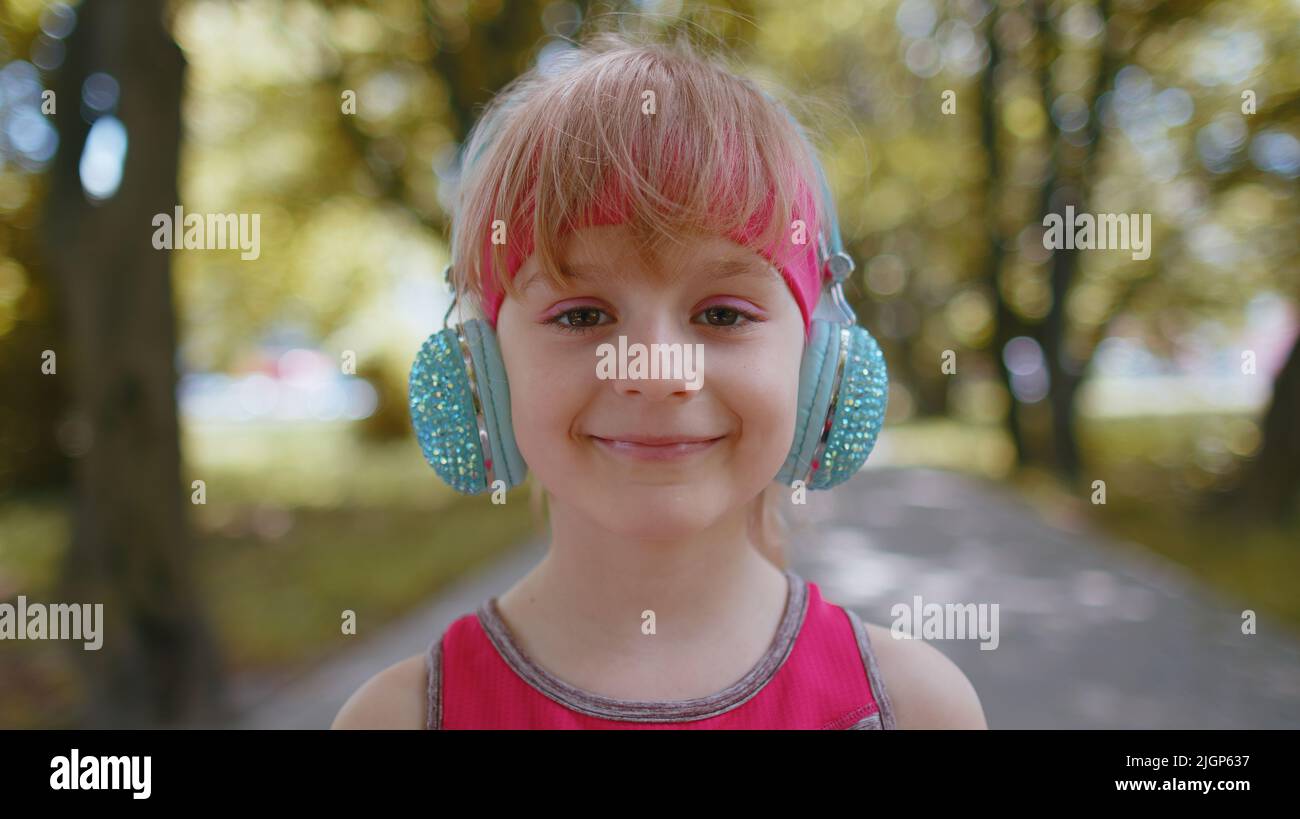 Athletic fitness sport runner child girl training, listening favorite ...