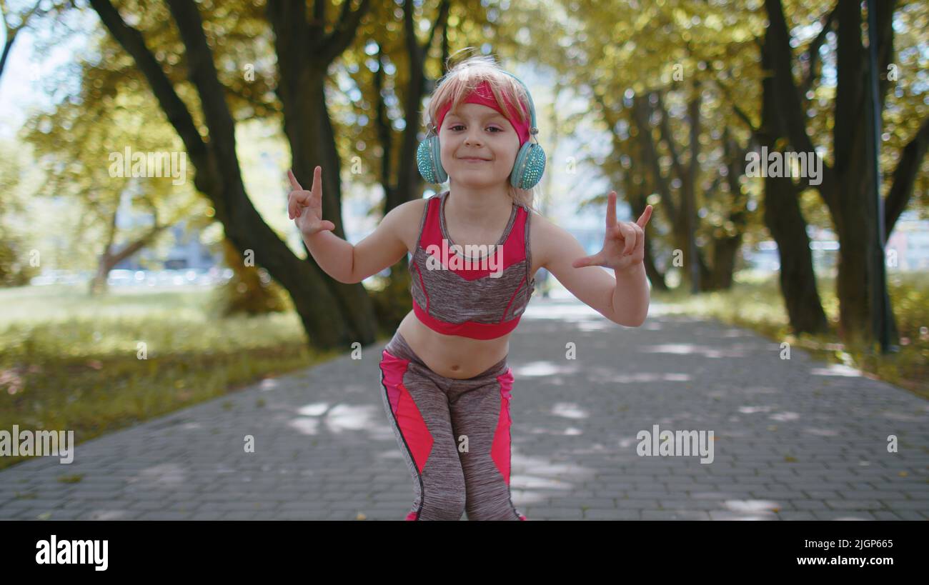 Athletic fitness sport runner child girl training exercise listening ...