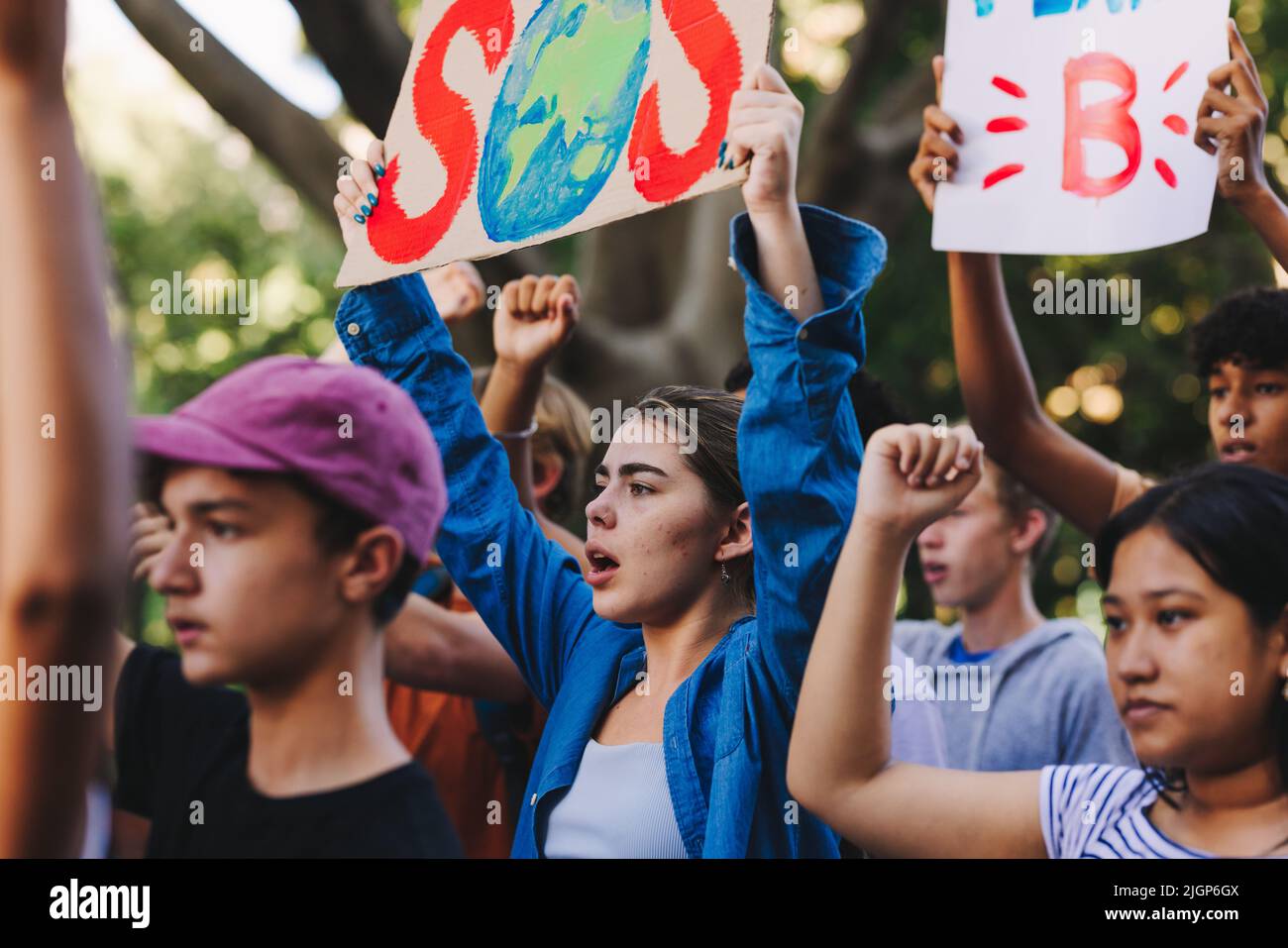Teenagers campaigning to save planet earth. Group of multicultural ...
