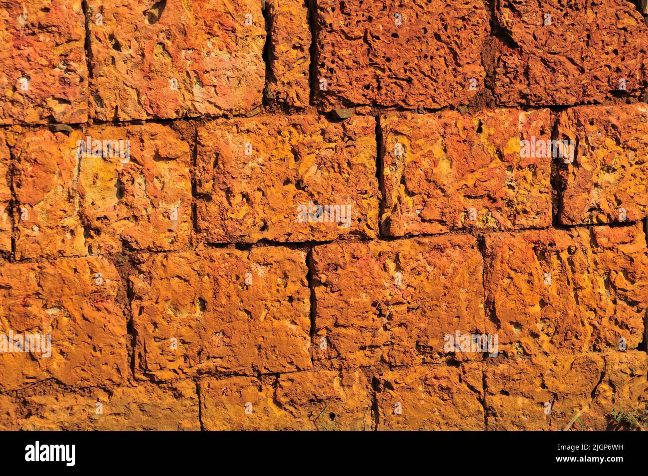 Texture on Red Laterite stone wall at Achara state Maharashtra India 11 07 2011 Stock Photo - Alamy