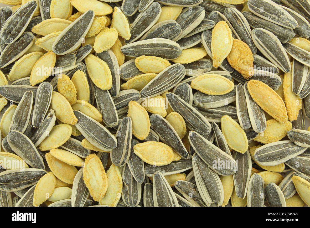 Background texture full of mixed salty pumpkin and sunflower seeds ...