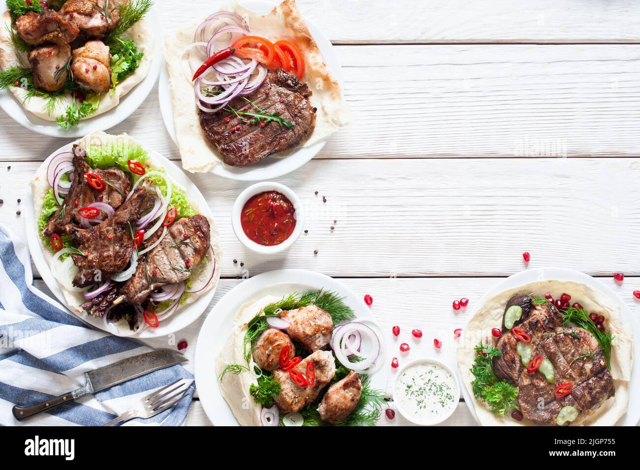 Grilled meat meals on table free space Stock Photo - Alamy