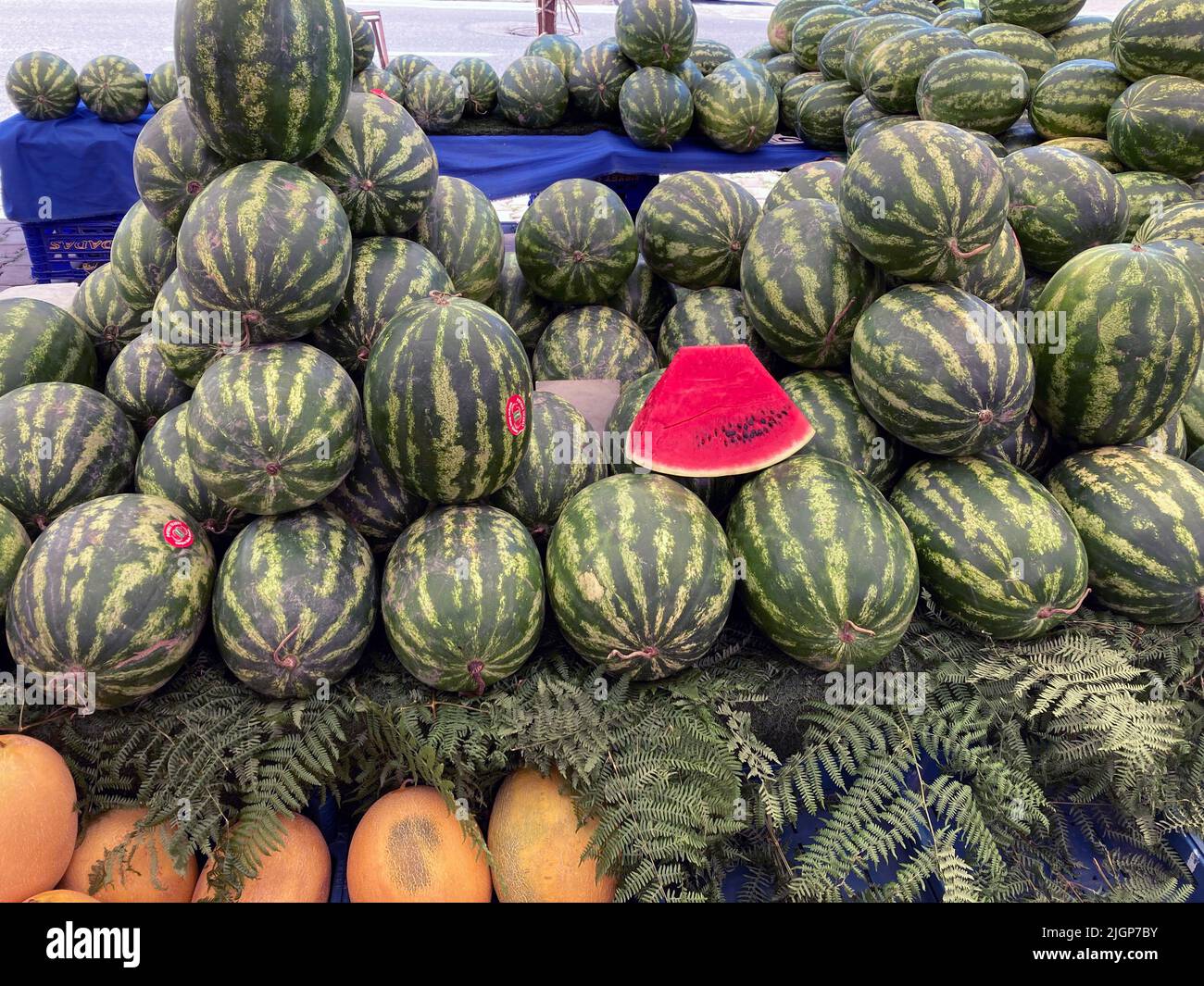 Watermelon, sliced red watermelon, adana watermelon and yellow melon on ...