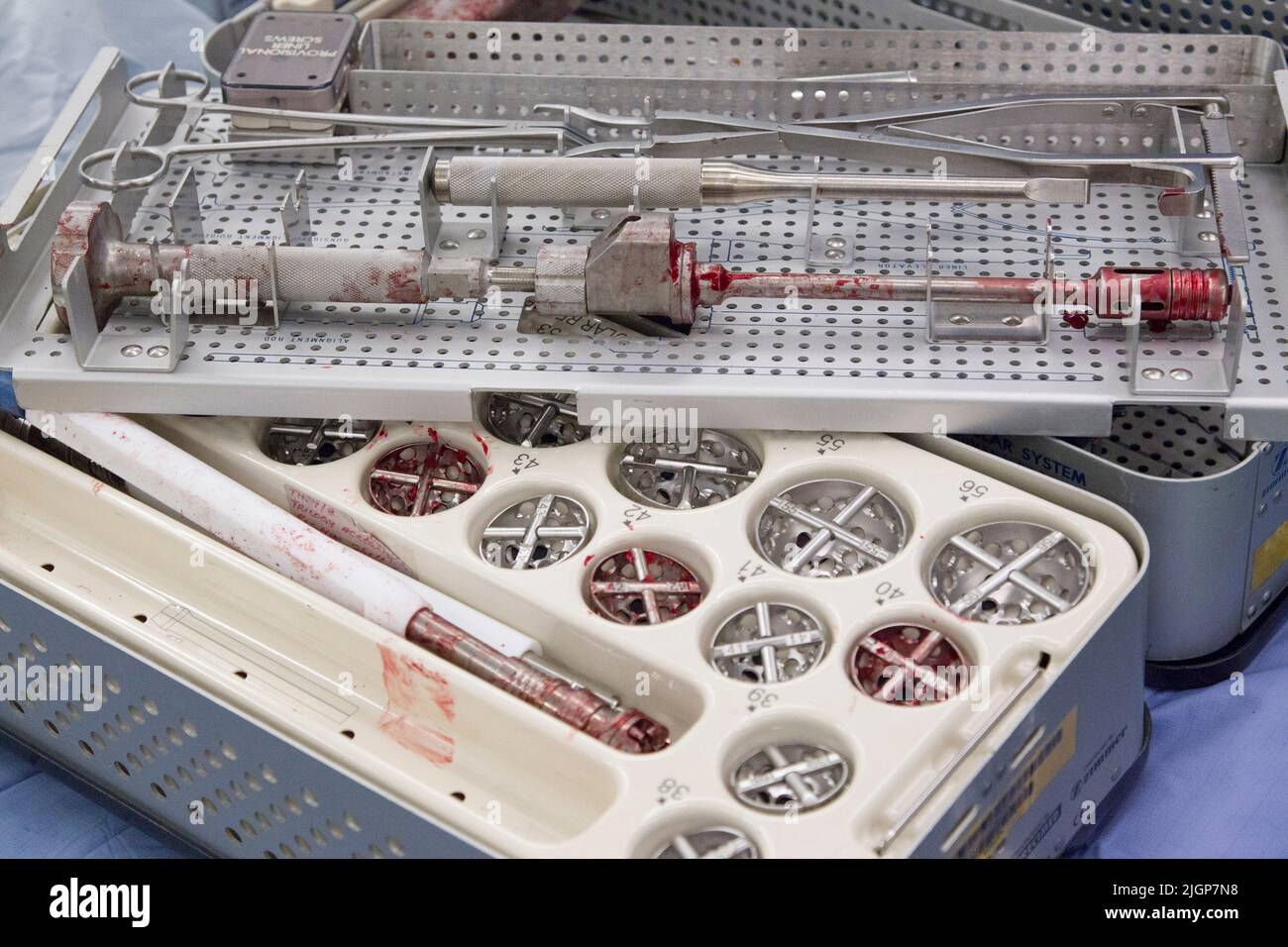 Detail of drill parts being used while performing knee surgery in a ...