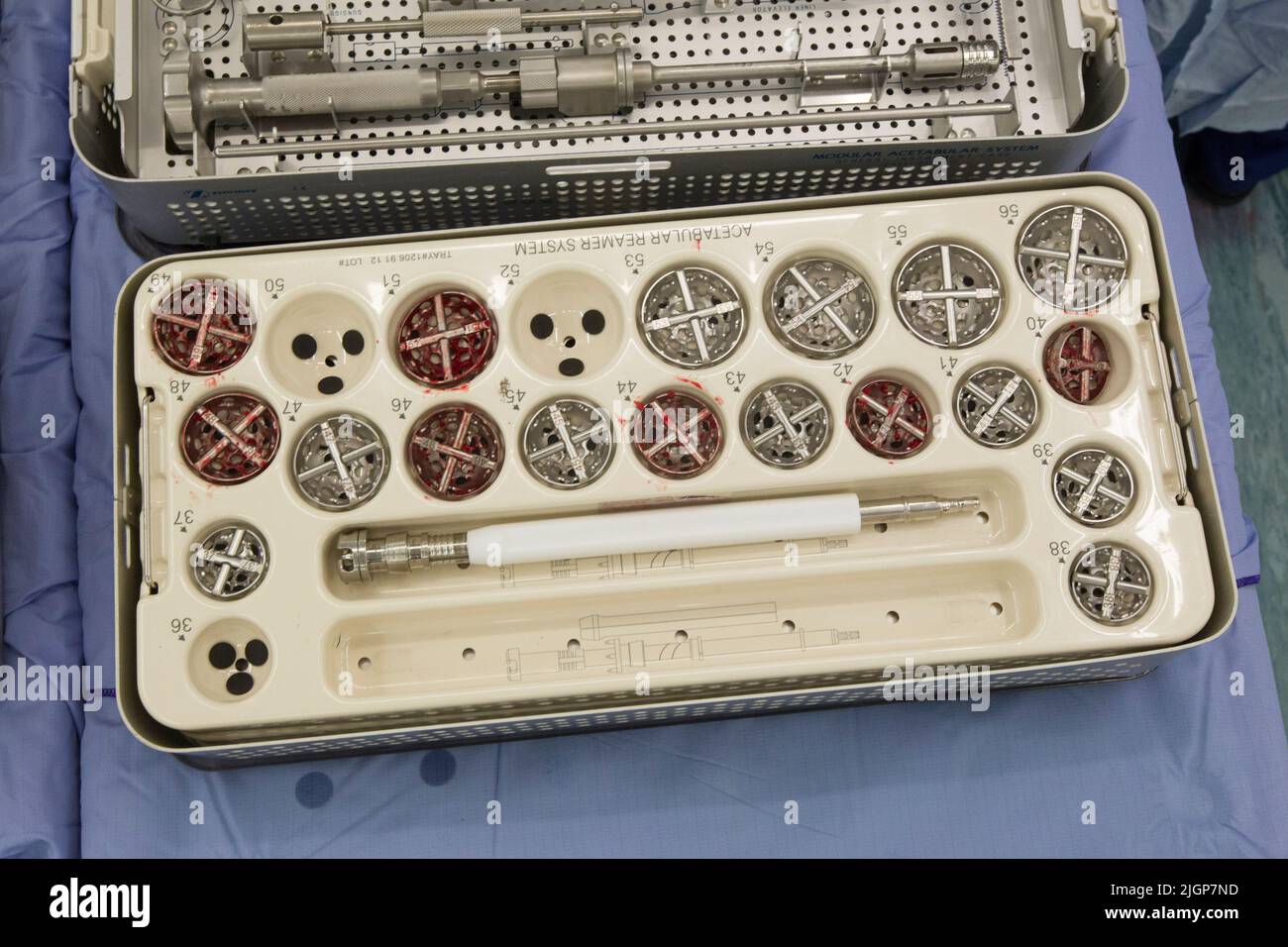 Detail of drill parts being used while performing knee surgery in a ...