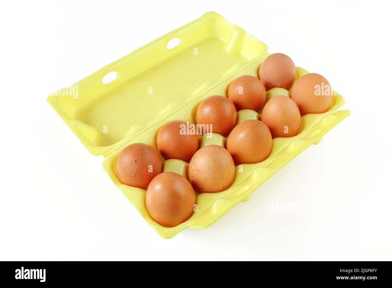 Ten hen eggs in yellow styrofoam container isolated on white background ...