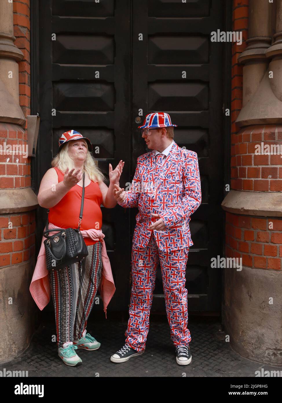 Friends Jane Bacon and Tristan Fox on a parade route during a Twelfth ...
