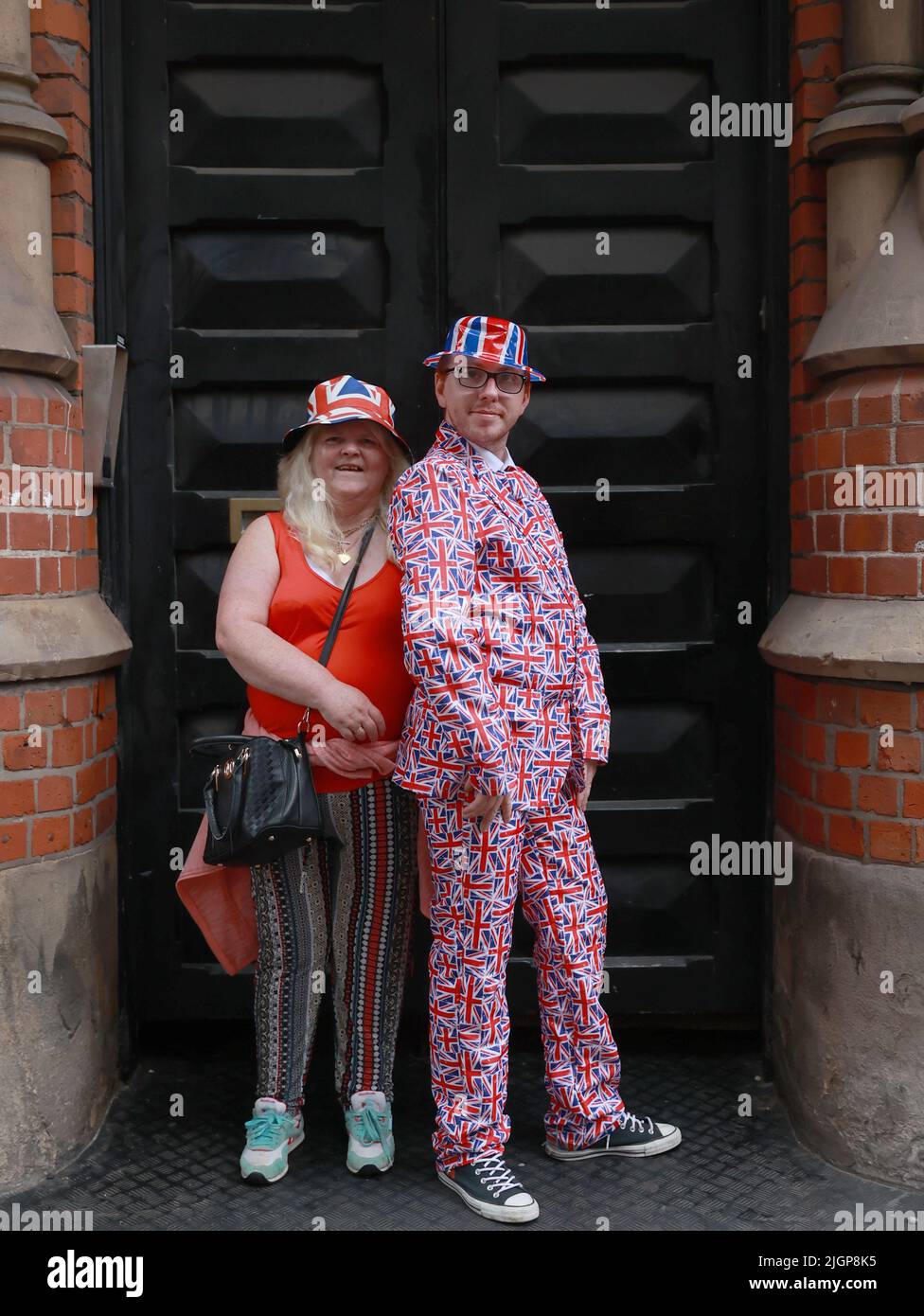 Friends Jane Bacon and Tristan Fox on a parade route during a Twelfth ...