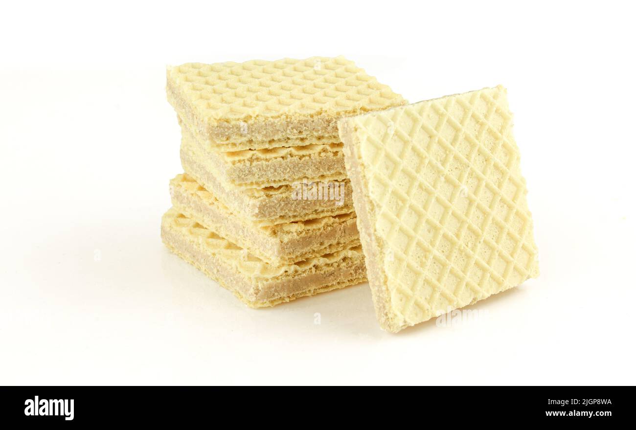 Stack of thin vanilla filled wafer biscuits isolated on white ...
