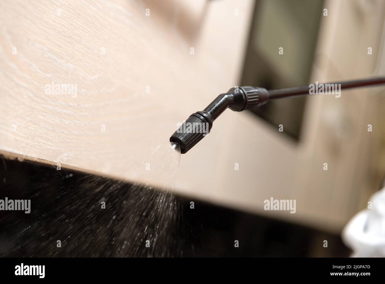 Spray gun with pesticides close-up. Fight against insects in apartments ...