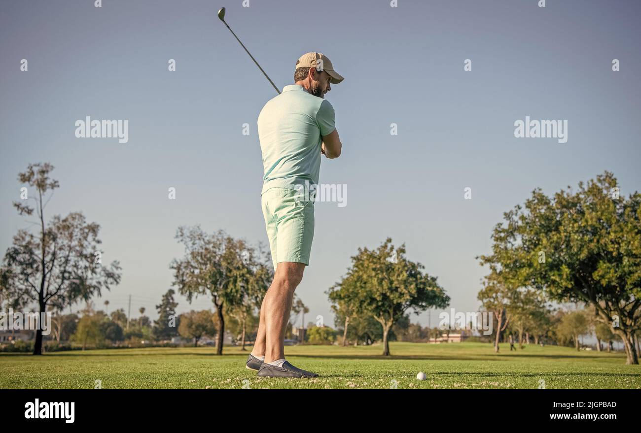 male golf player on professional golf course. portrait of golfer in cap ...