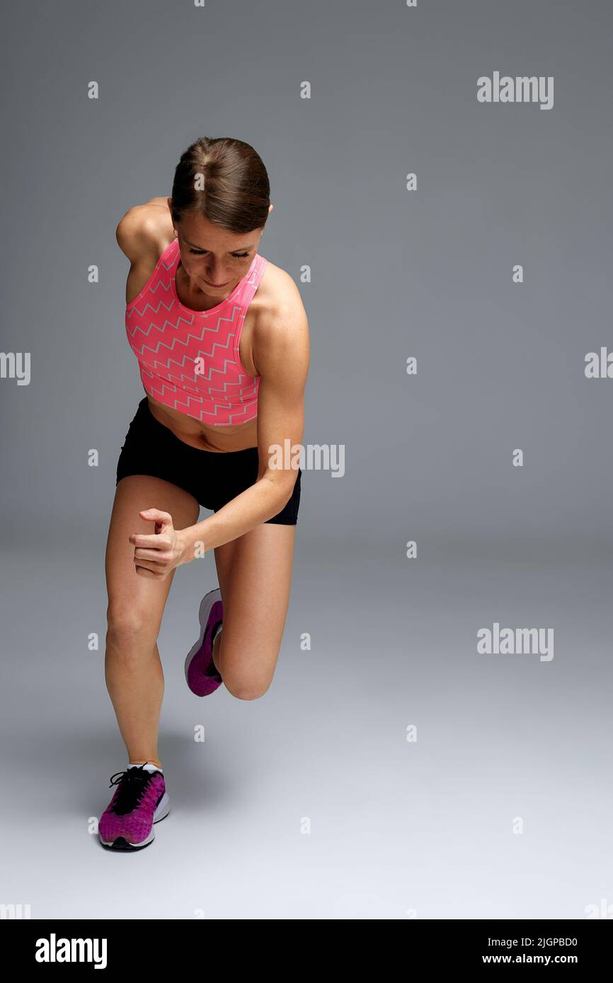 Fitness woman jumping and running, working out. Athletic girl doing ...