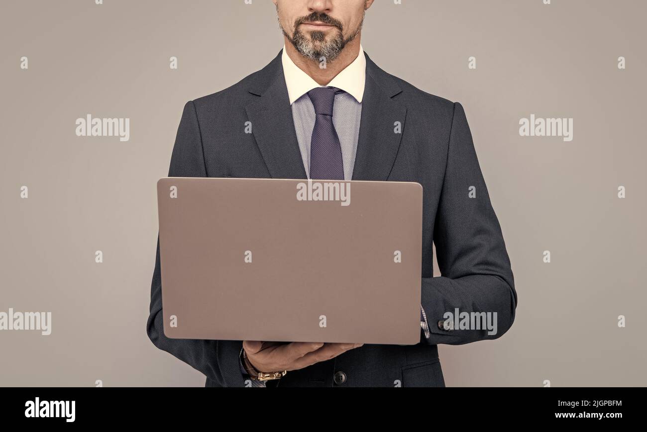 cropped man businessman in suit has grizzled beard working on computer ...