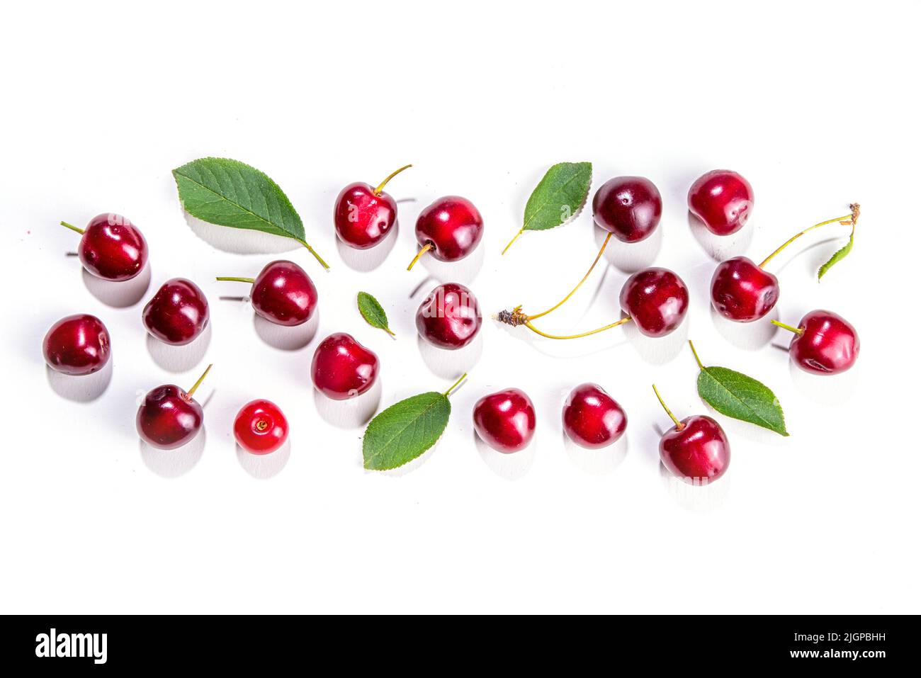 Fresh ripe raw cherry berry with leaf isolated on white background ...