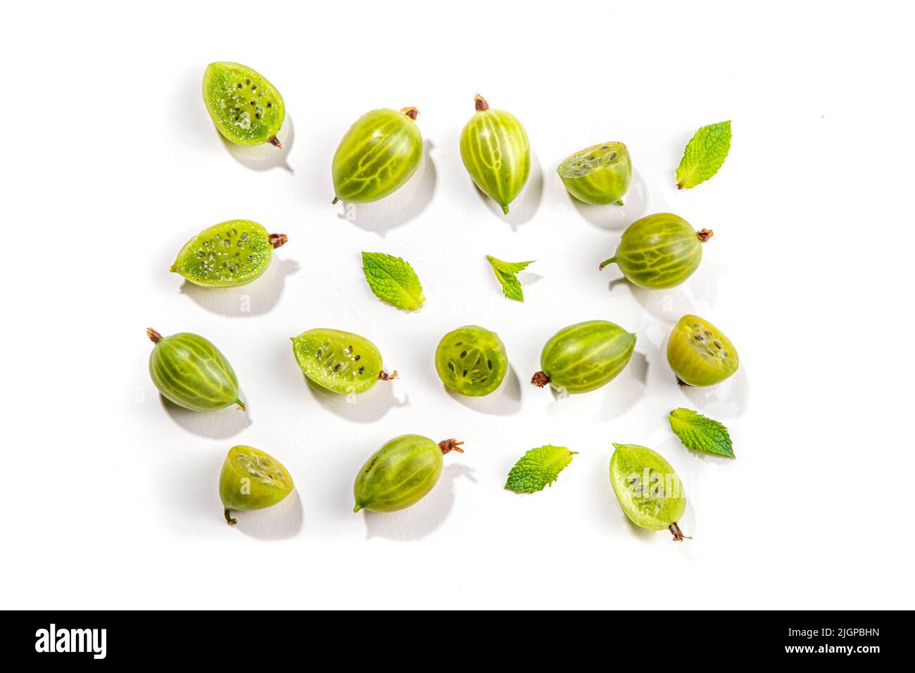 Fresh ripe raw green gooseberry, group of whole and half gooseberries ...