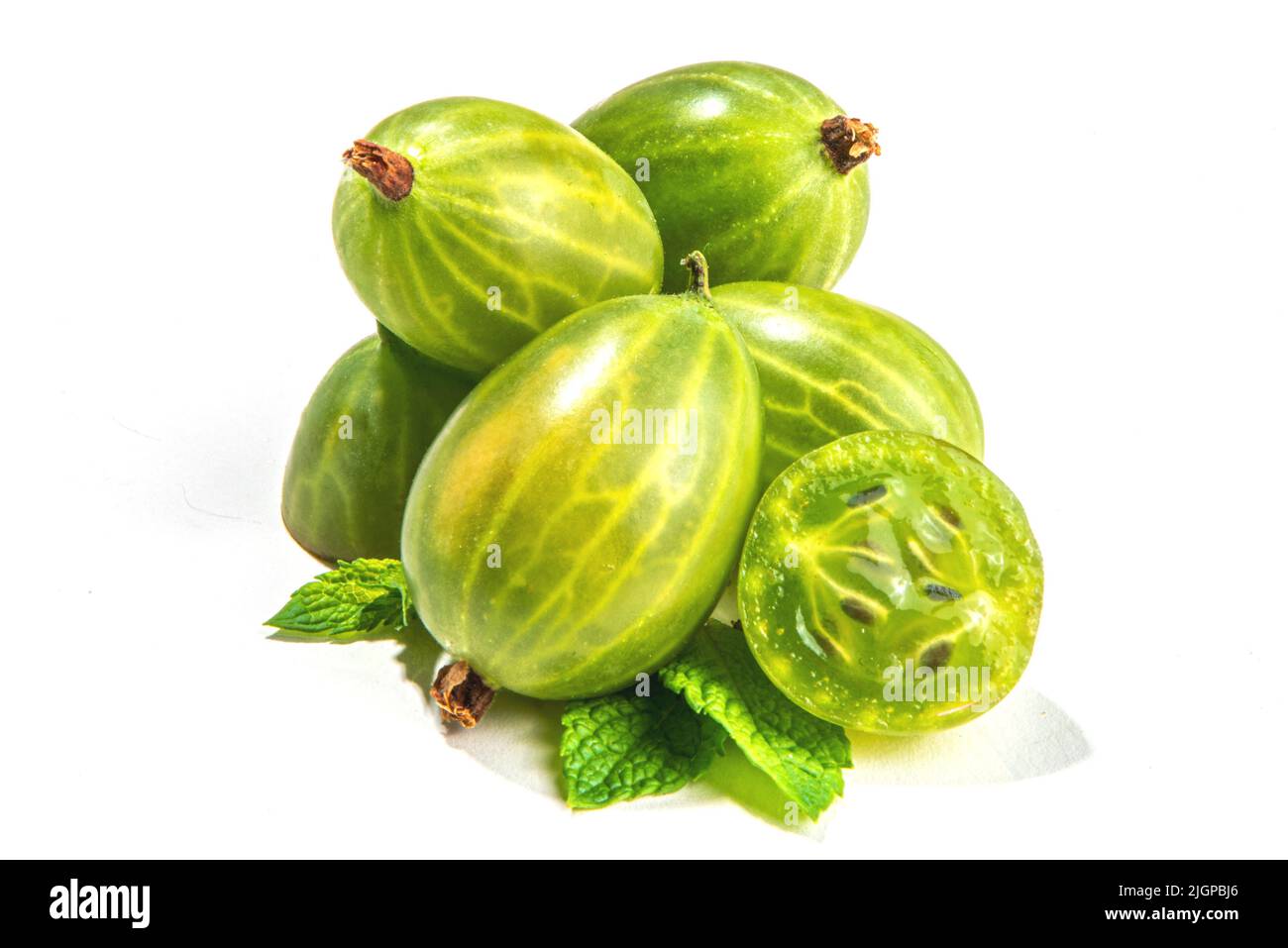 Fresh ripe raw green gooseberry, group of whole and half gooseberries ...