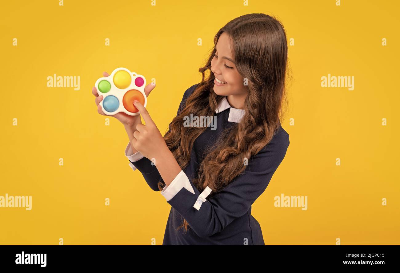 girl with finger game. kid popping anti stress bubble. motor skills ...