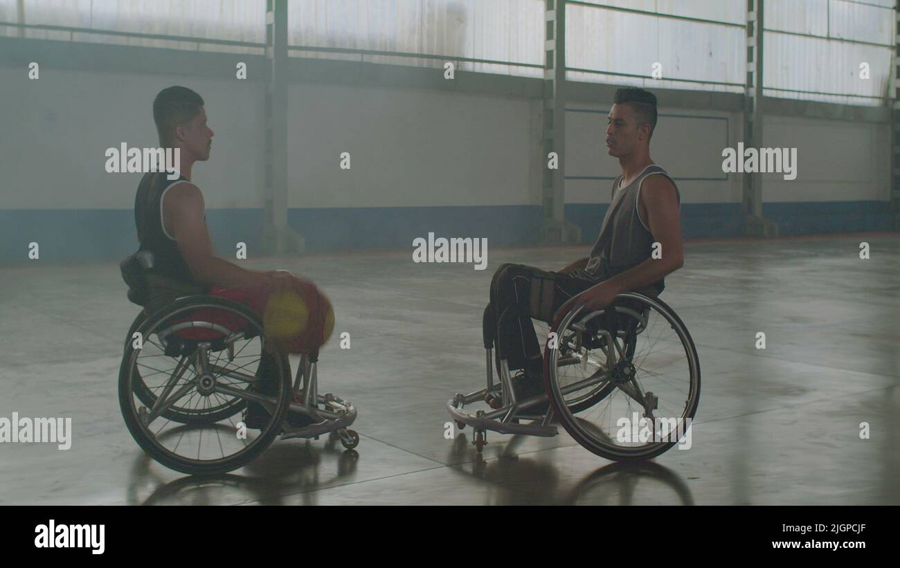 Two disabled basketball athletes on wheelchairs talking Stock Photo - Alamy