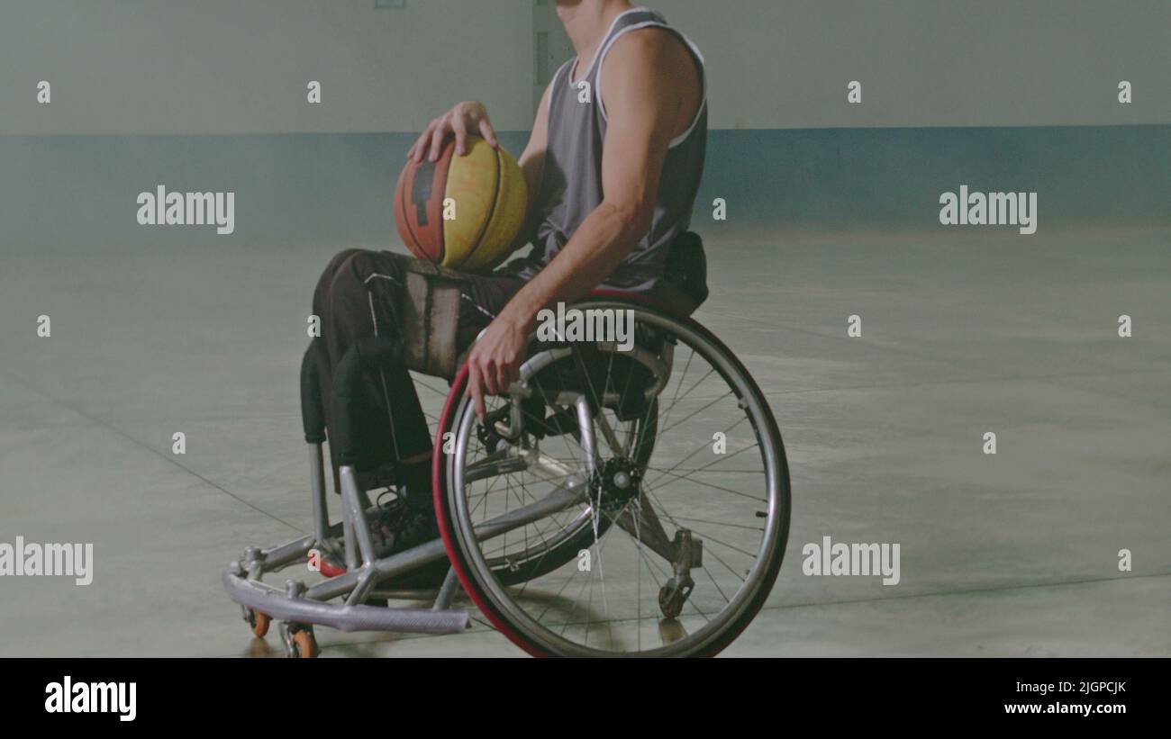One hispanic disabled basketball player athlete on wheelchair holding ...