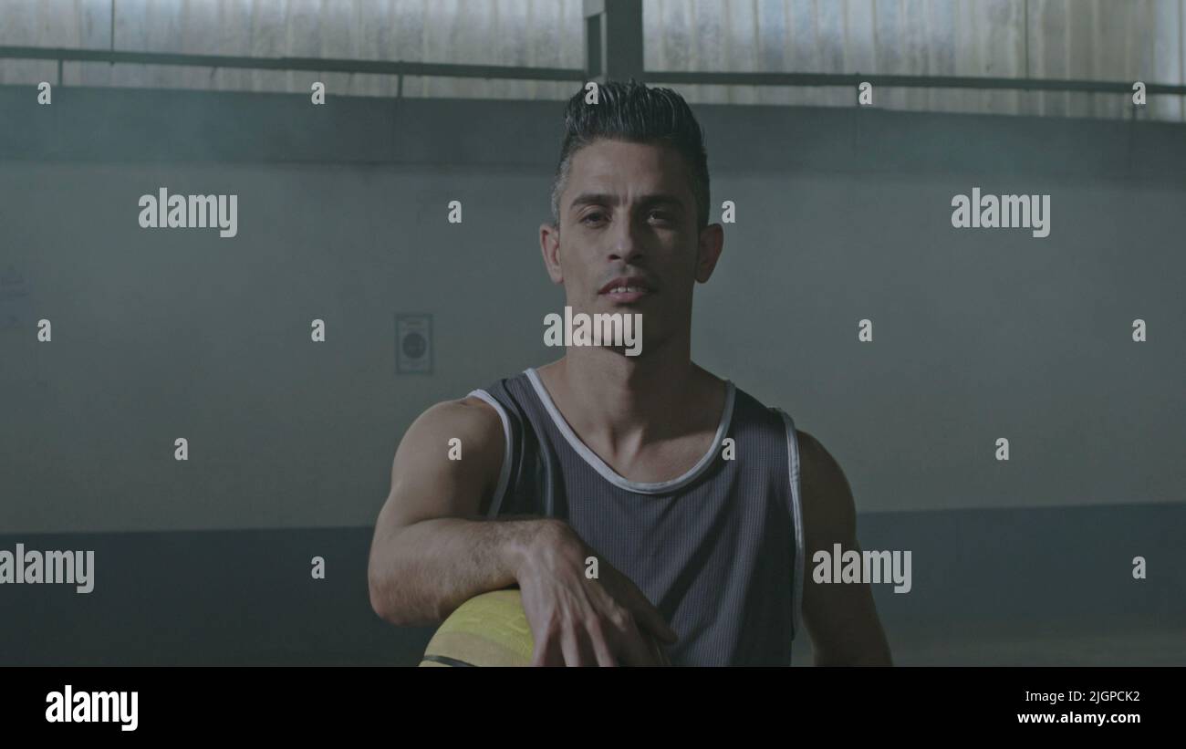 One hispanic disabled basketball player athlete on wheelchair holding ...