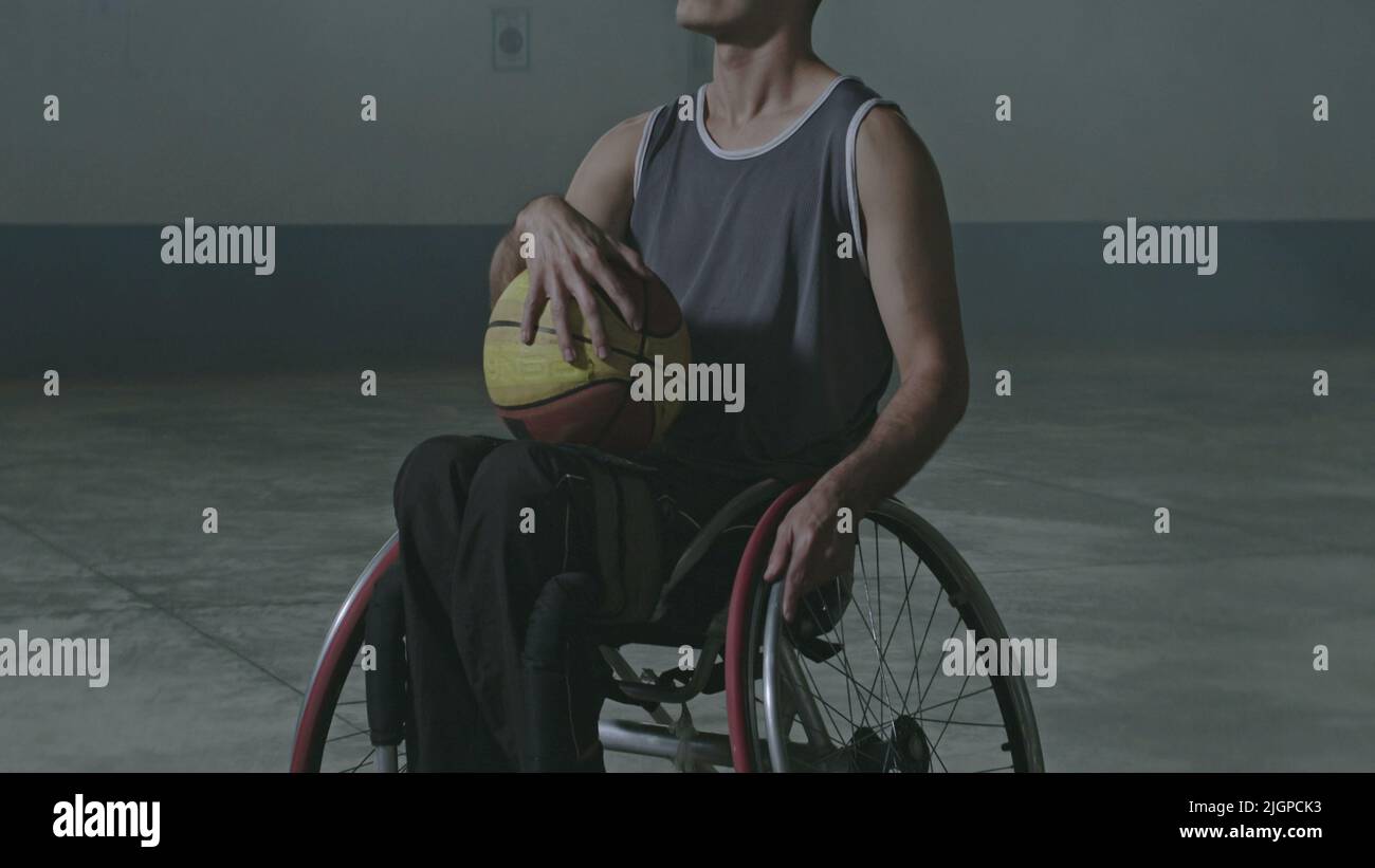 One hispanic disabled basketball player athlete on wheelchair holding ...