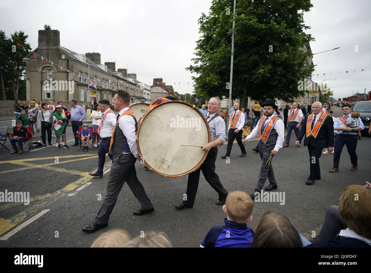 Members of the Orange Order carry Lambeg drums as they take part in a ...