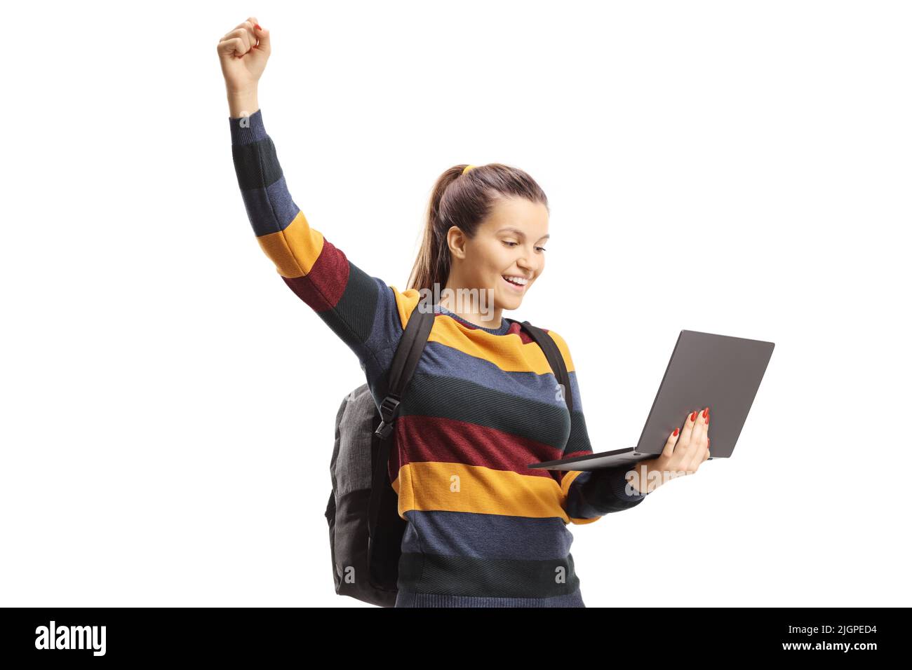 Excited female student holding a laptop and gesturing happiness with ...