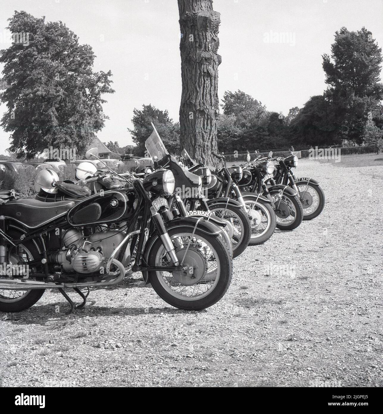 1960s, historical, a number of BMW motorcycles of the era parked beside ...