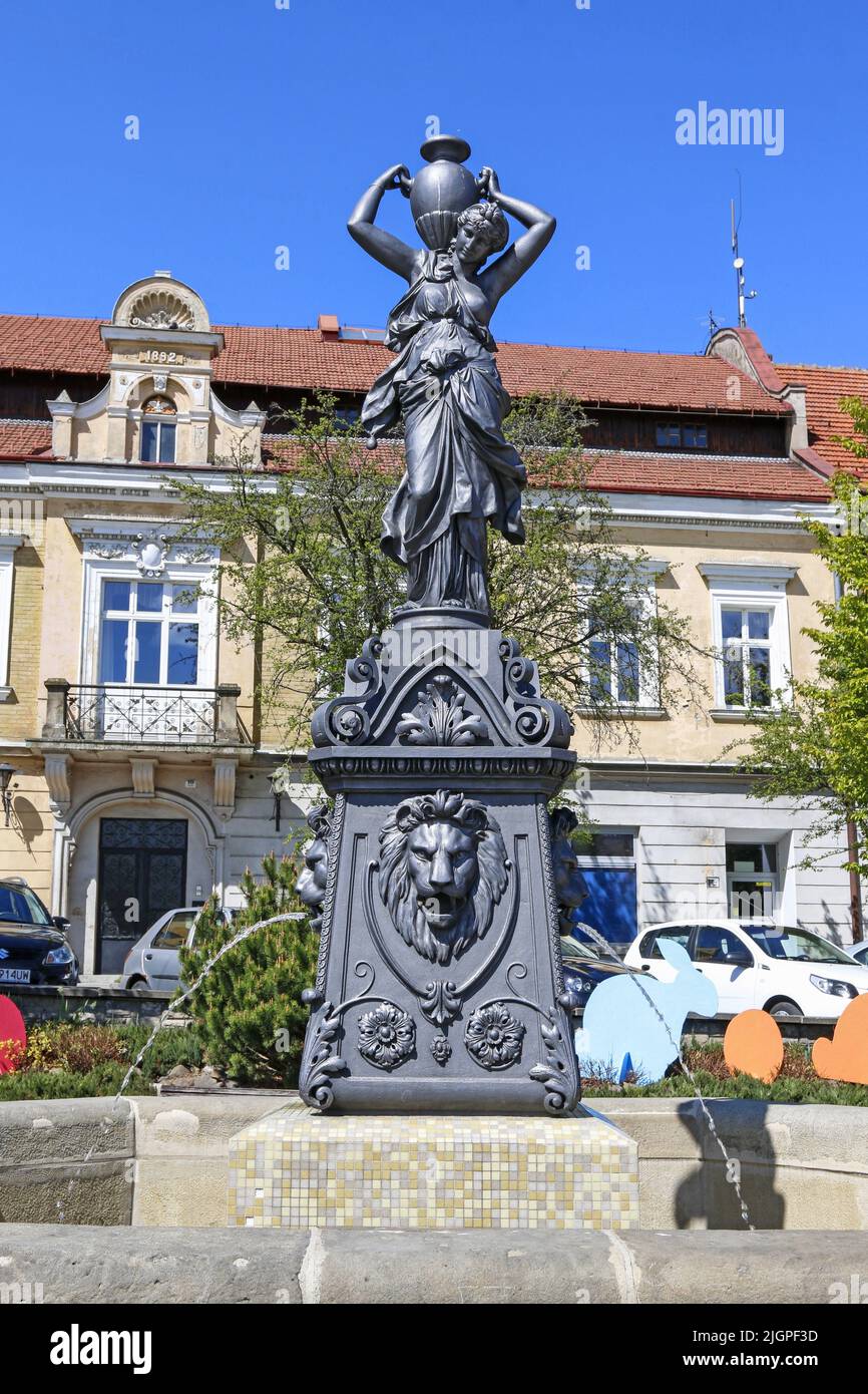The fountain on the main market square in Myslenice, Poland Stock Photo ...