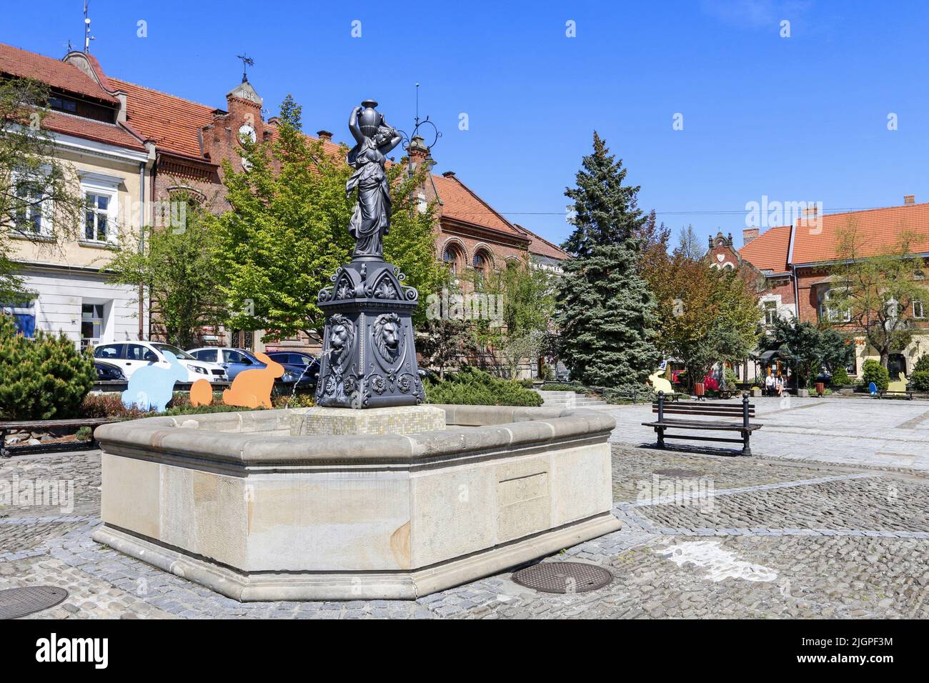 The fountain on the main market square in Myslenice, Poland Stock Photo ...