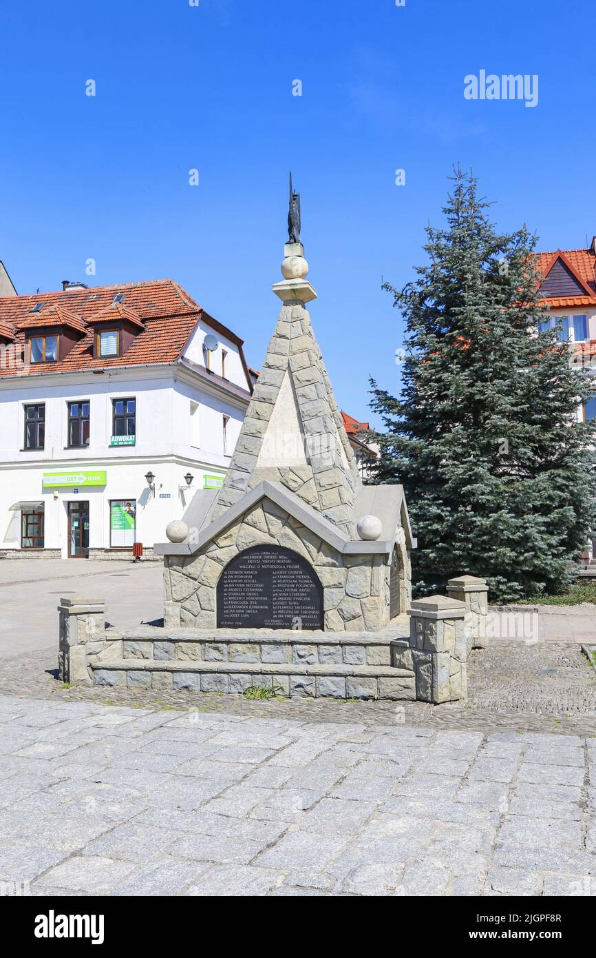The monument on the main market square in Myslenice, Poland Stock Photo ...