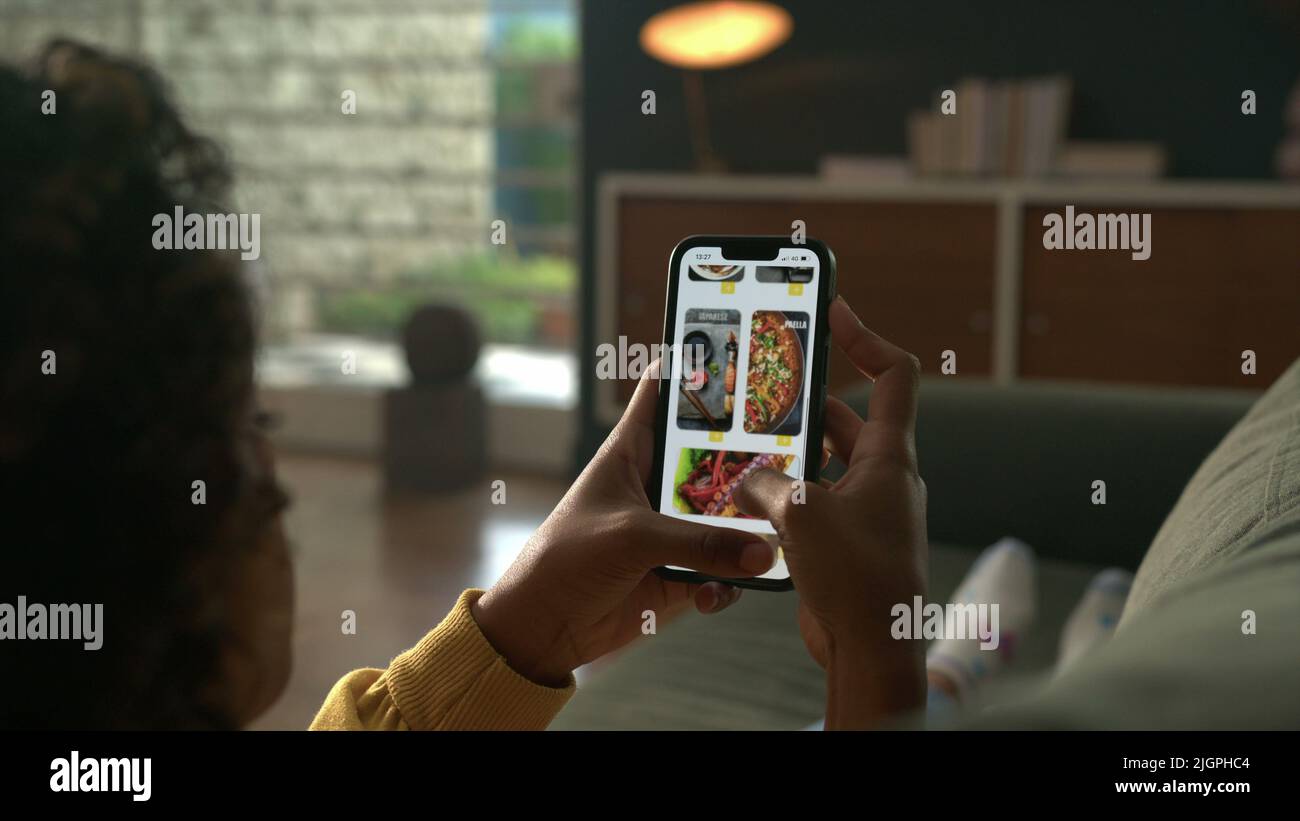 Person Using Online Delivery menu phone. Woman Orders at Food Home In Online Store using ...